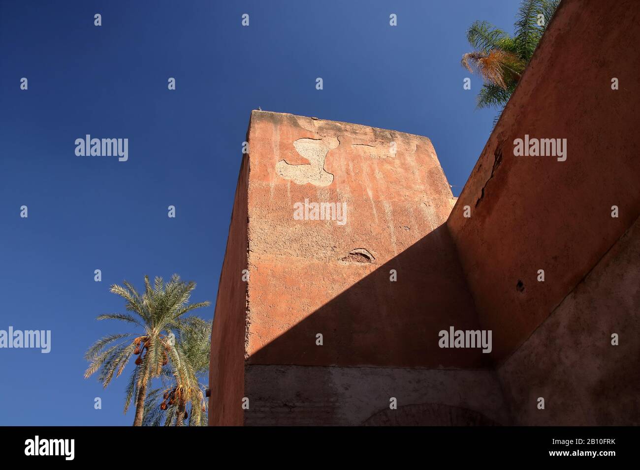Down view of traditional historical medieval clay wall and plams in ...