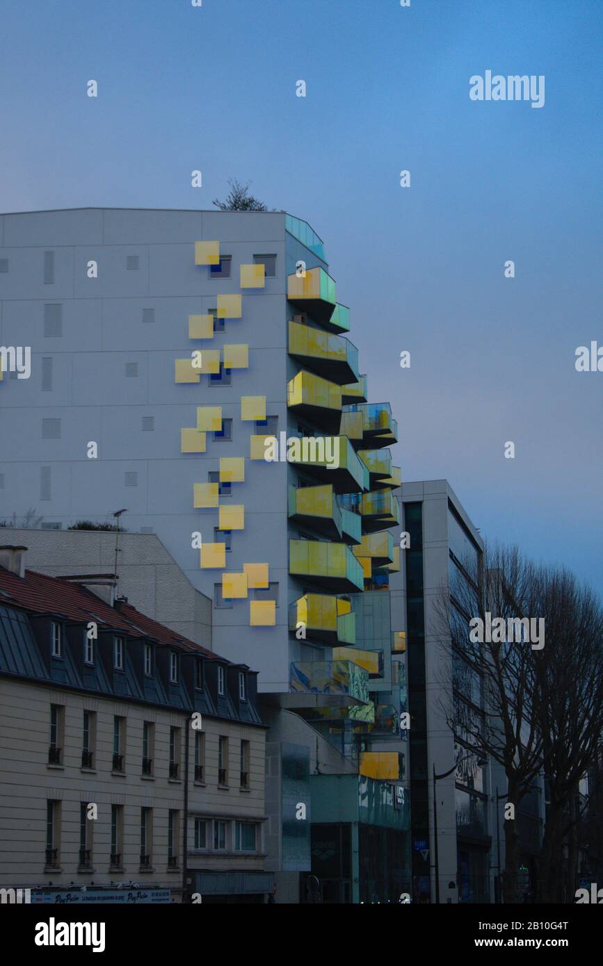 Strange glass building facade in green yellow in Paris Stock Photo - Alamy