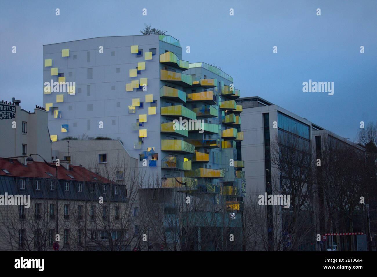 Strange glass building facade in green yellow in Paris Stock Photo - Alamy
