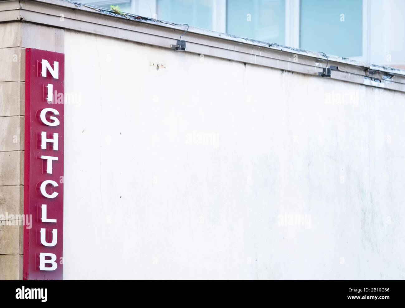 Nightclub sign red and white on outdoor wall Stock Photo - Alamy