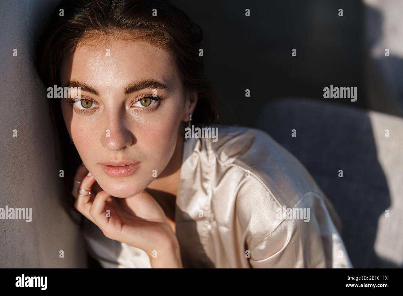 Pretty brunette woman in silk hi-res stock photography and images - Alamy