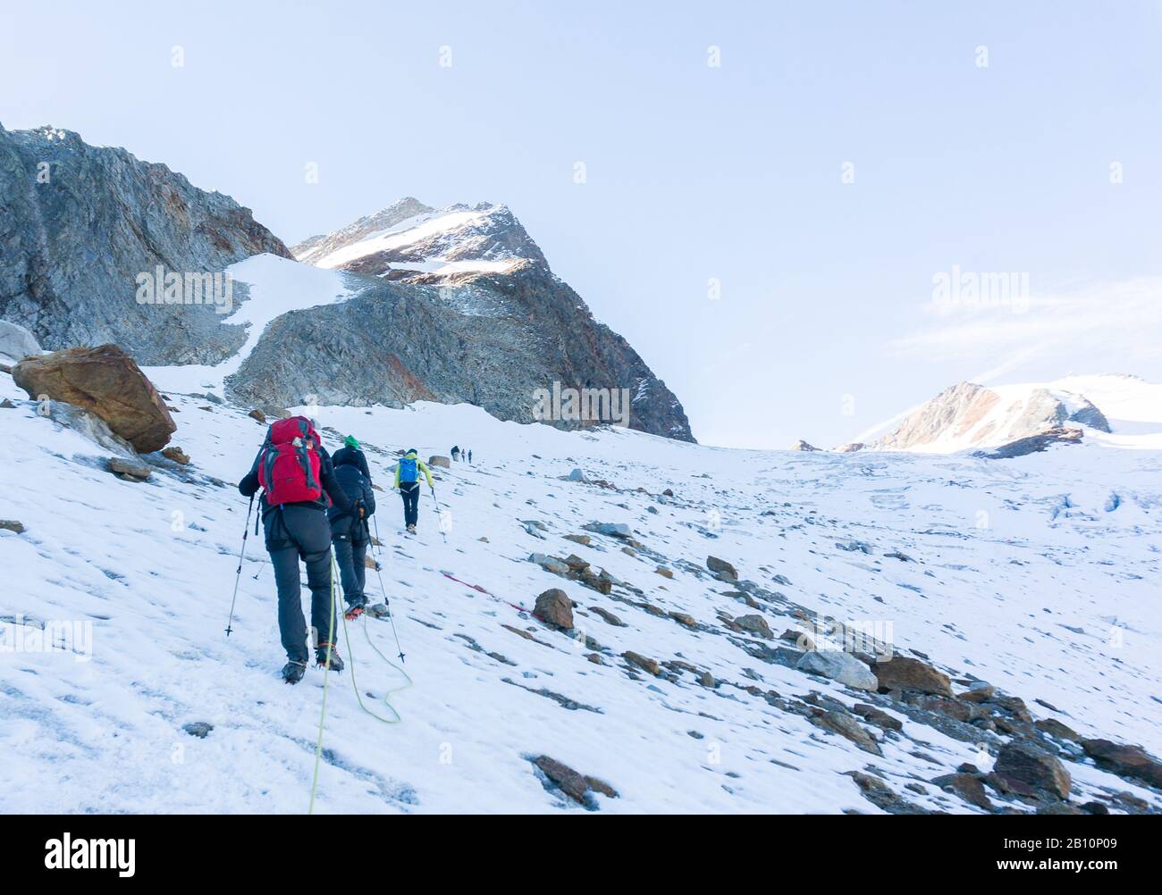 Hiking to mountain summit on snow glacier extreme trek Stock Photo - Alamy