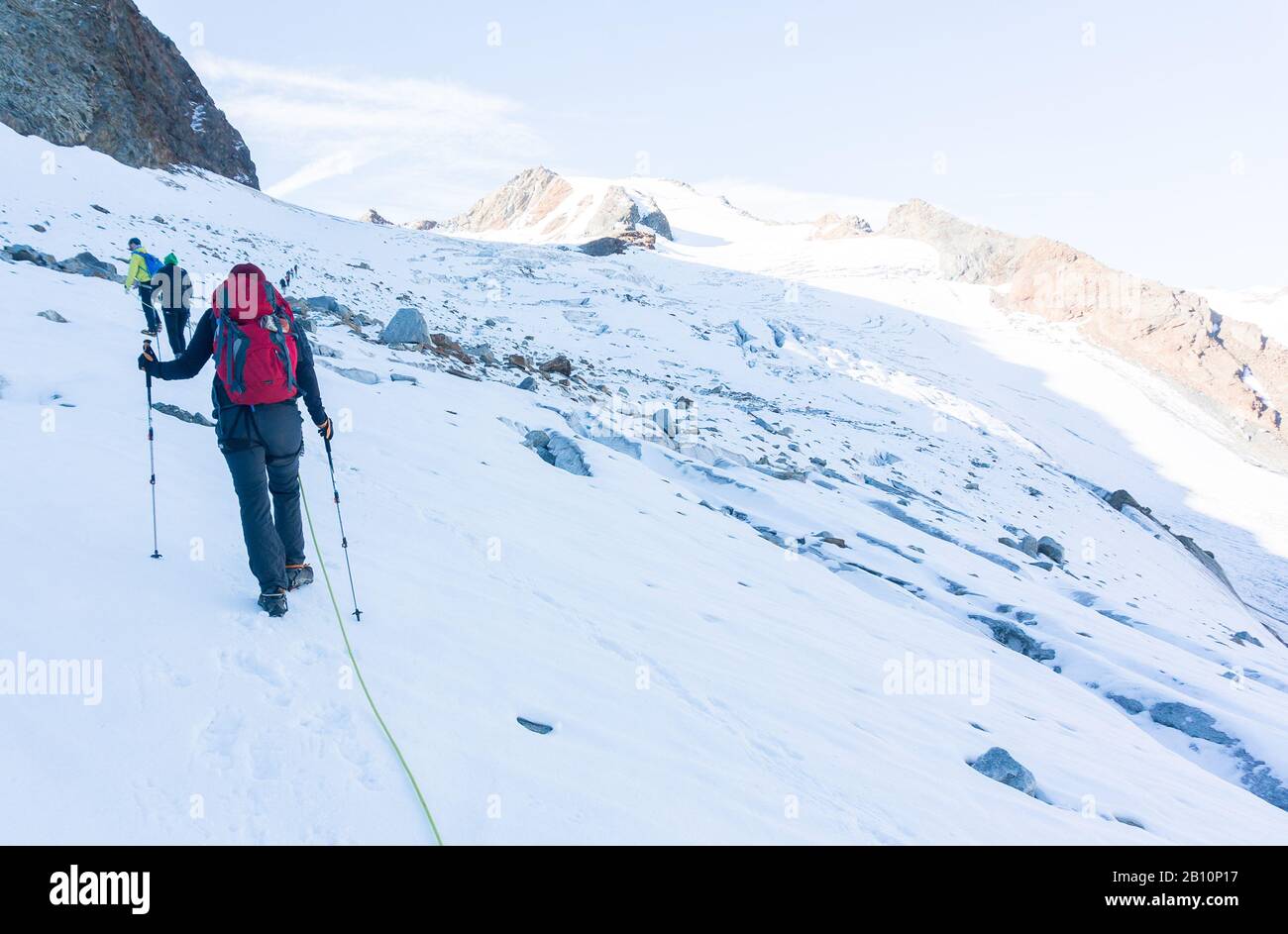 Hiking to mountain summit on snow glacier extreme trek Stock Photo - Alamy
