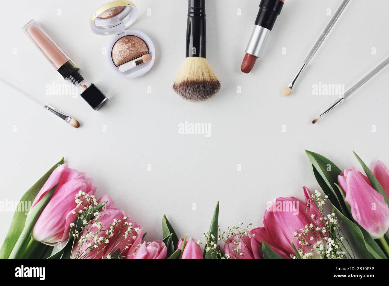 Tulips, beauty mood. Beautiful spring flowers bouquet with cosmetics ...