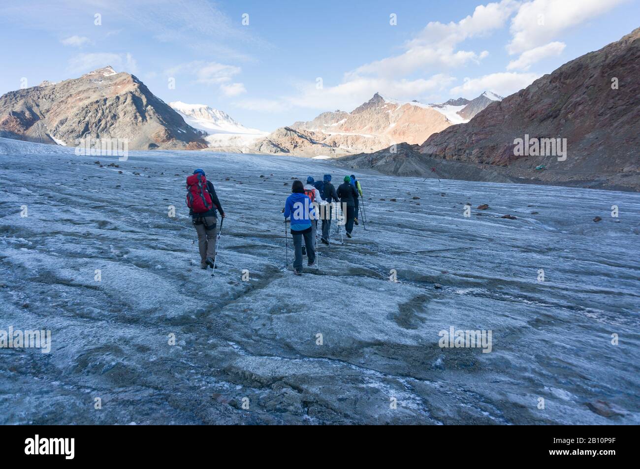 Hiking to mountain summit on snow glacier extreme trek Stock Photo - Alamy