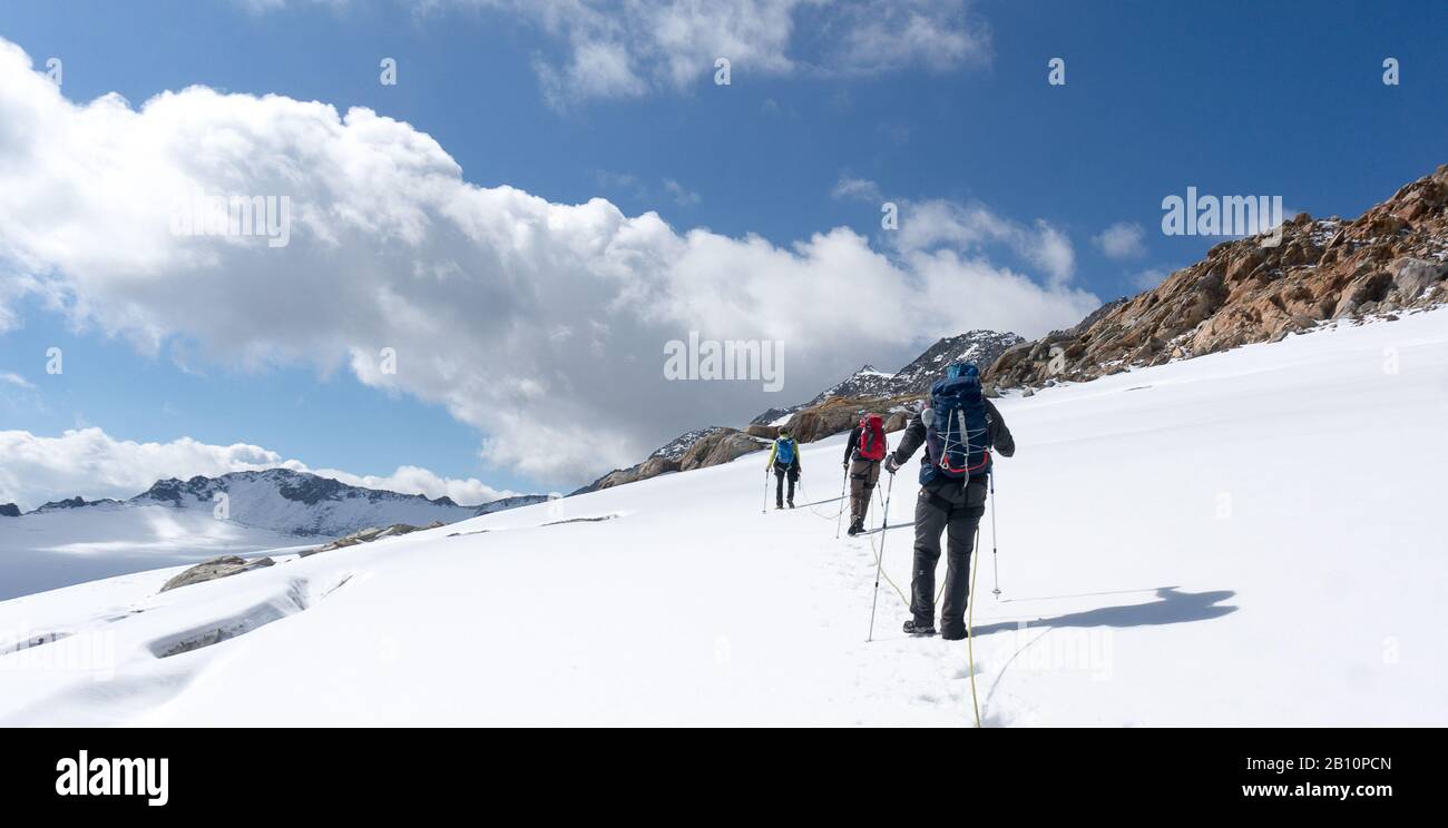 Hiking to mountain summit on snow glacier extreme trek Stock Photo - Alamy