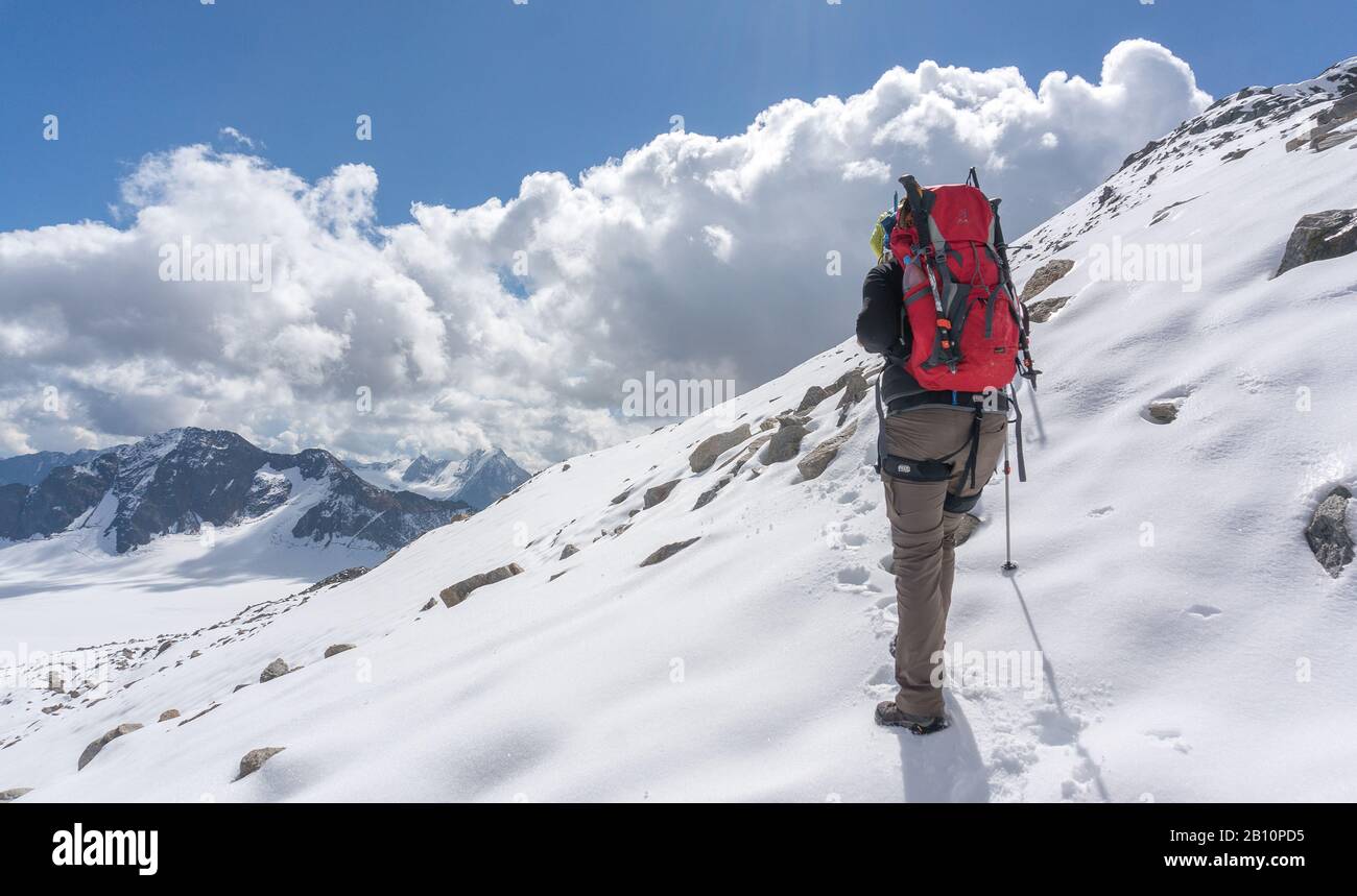 Hiking to mountain summit on snow glacier extreme trek Stock Photo - Alamy