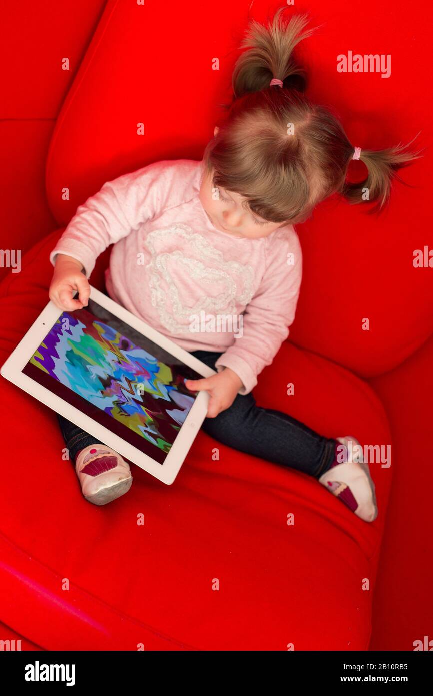 Little girl with tablet pc Stock Photo - Alamy