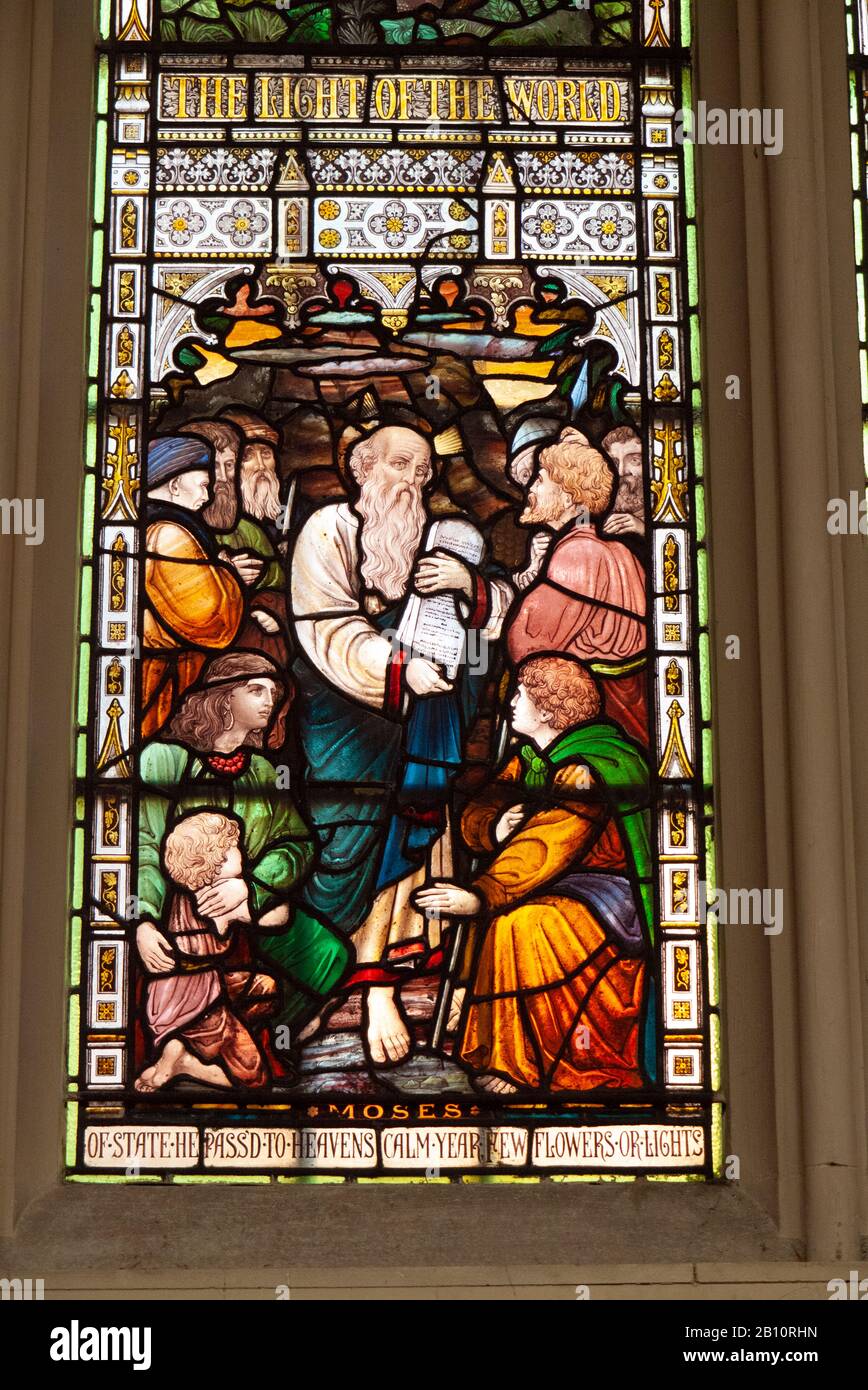 Stained glass window showing Moses and the Ten Commandments inside ...