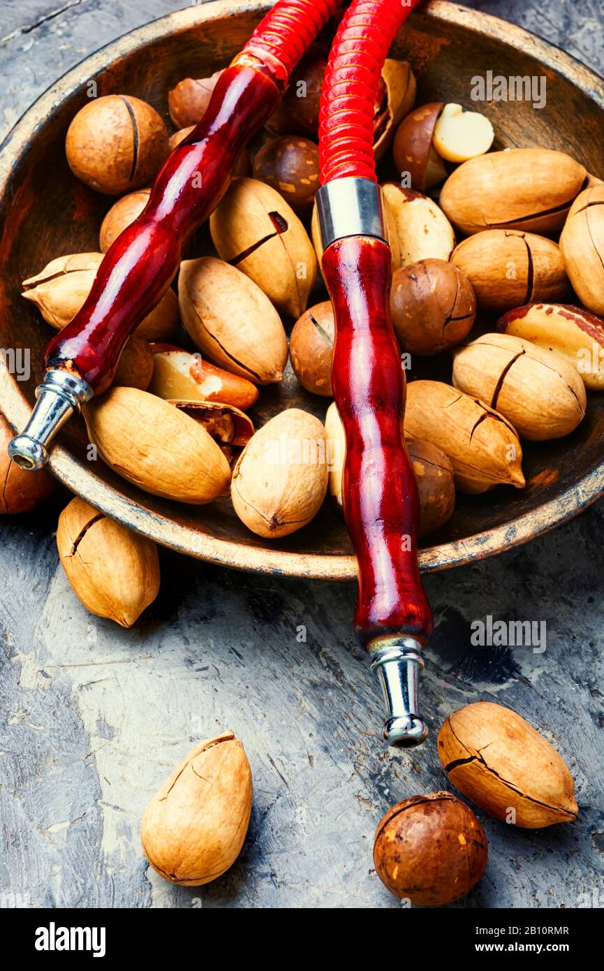 Tobacco smoking hookah with the aroma of nuts Stock Photo - Alamy