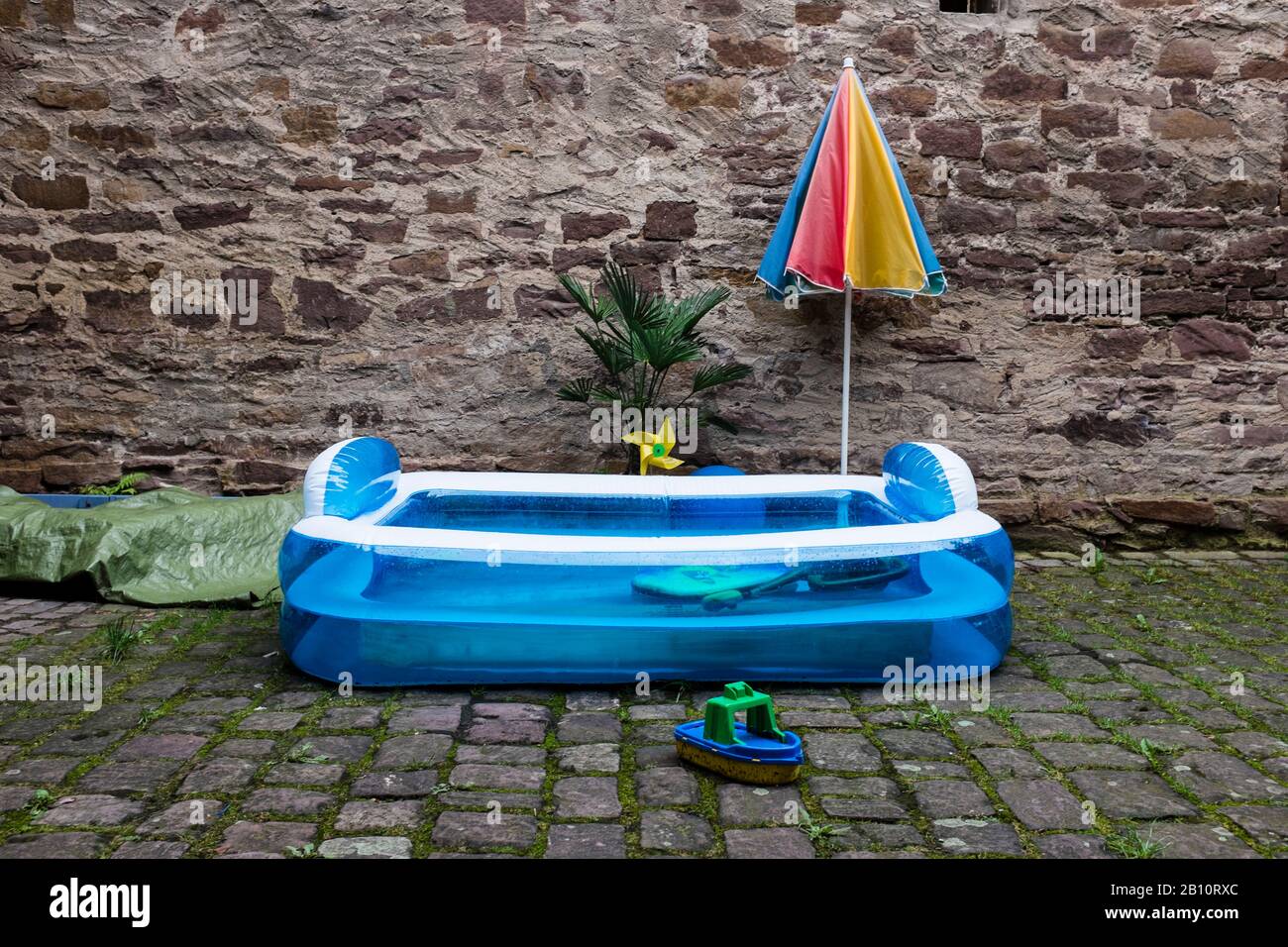 Paddling pool in front of a wall Stock Photo - Alamy