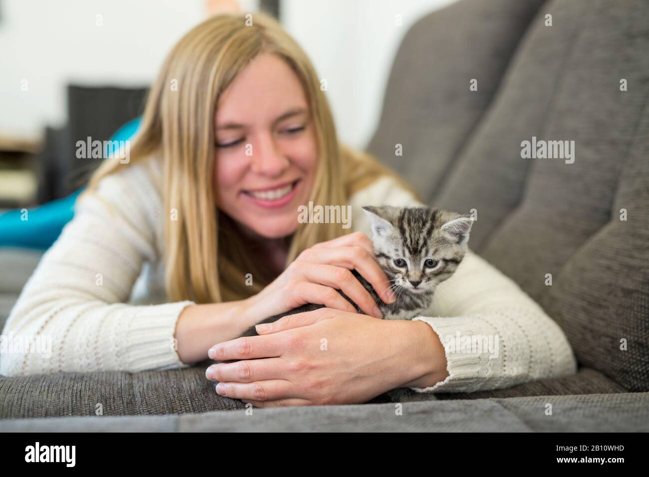 Young woman with kitten Stock Photo - Alamy