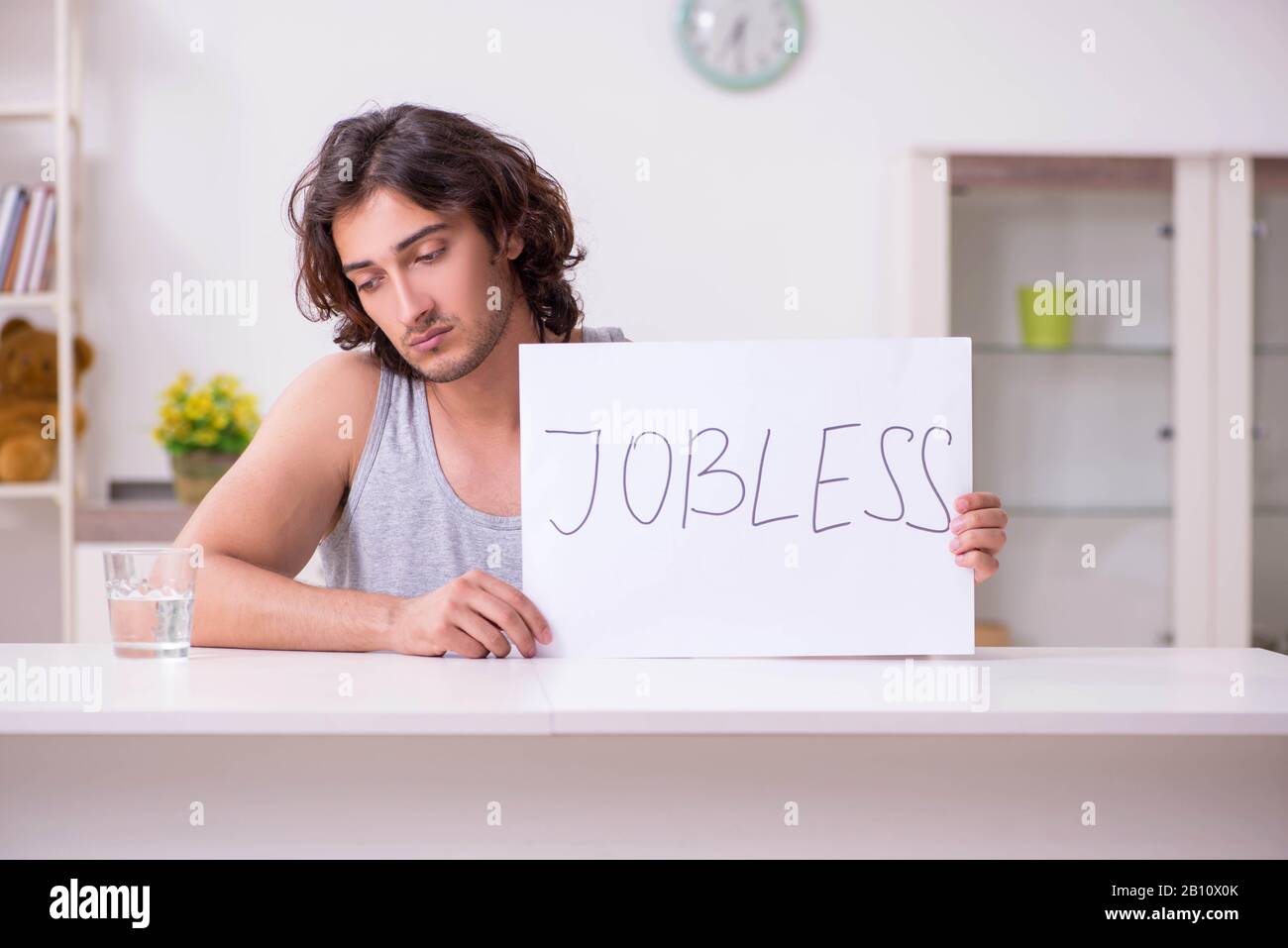 The unemployed man desperate at home Stock Photo - Alamy