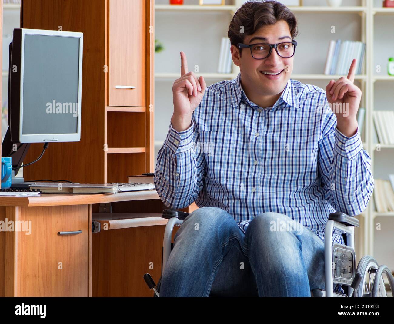 The disabled student studying at home on wheelchair Stock Photo - Alamy