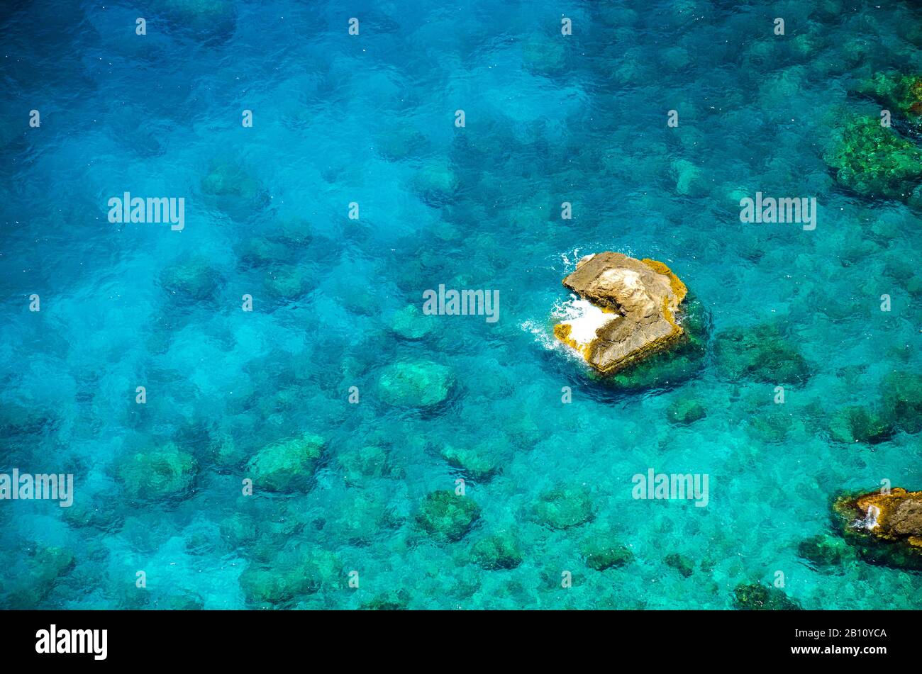 Sea aerial top view. Rocky beach with azure water and reefs ...