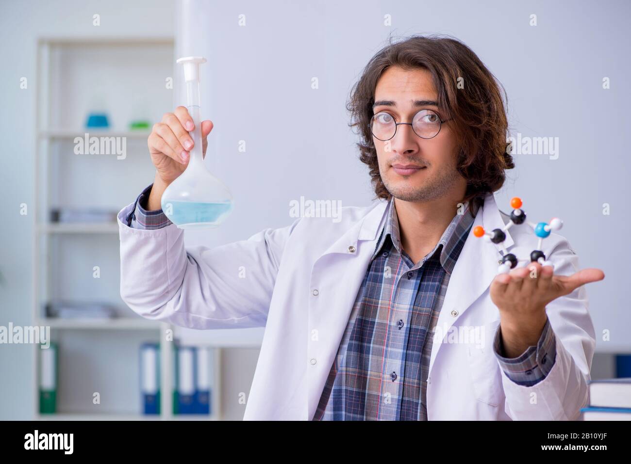 The chemistry lecturer during lecture in college Stock Photo - Alamy