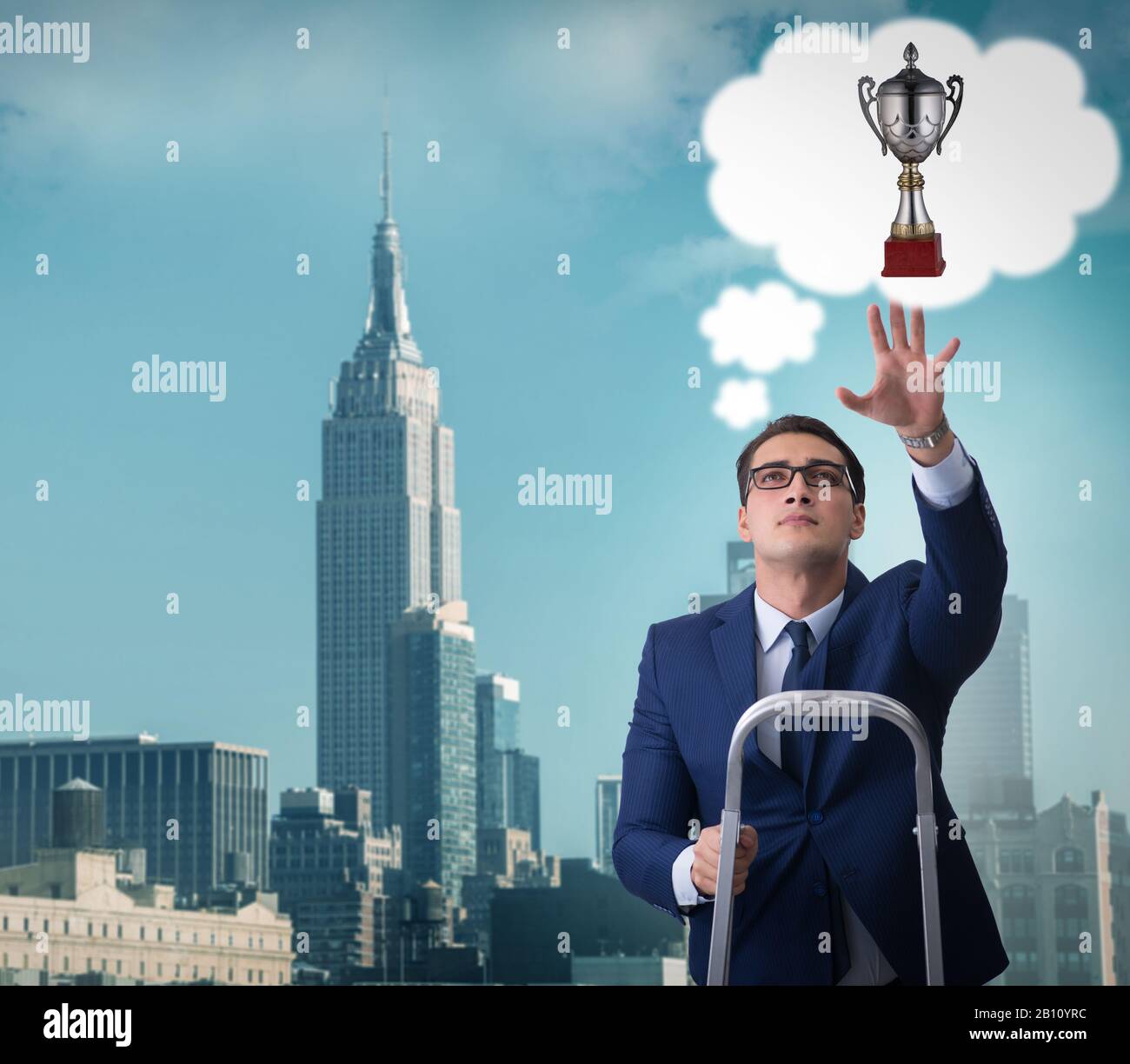 The businessman climbing towards his business goal Stock Photo - Alamy