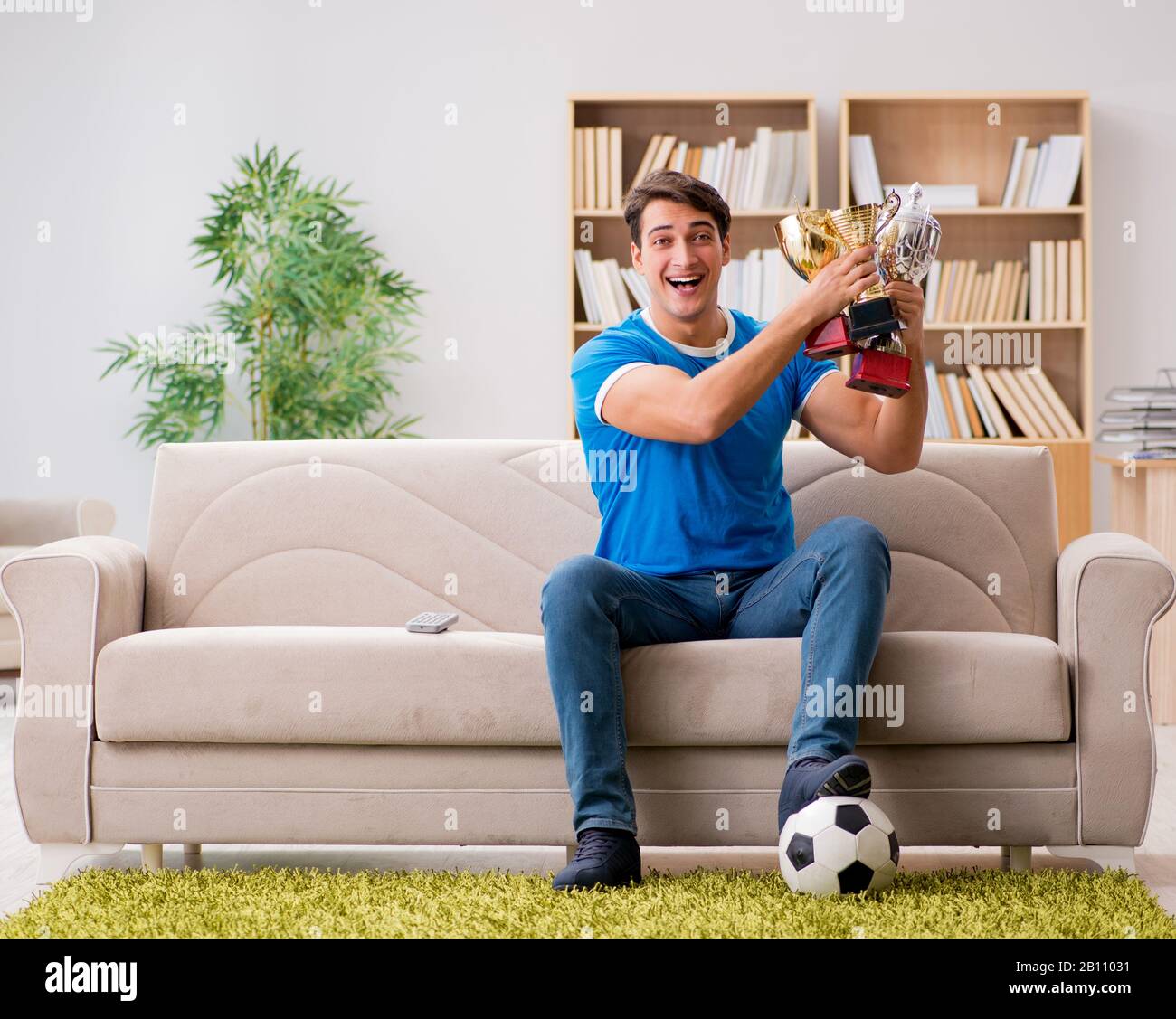 The man watching football at home Stock Photo - Alamy