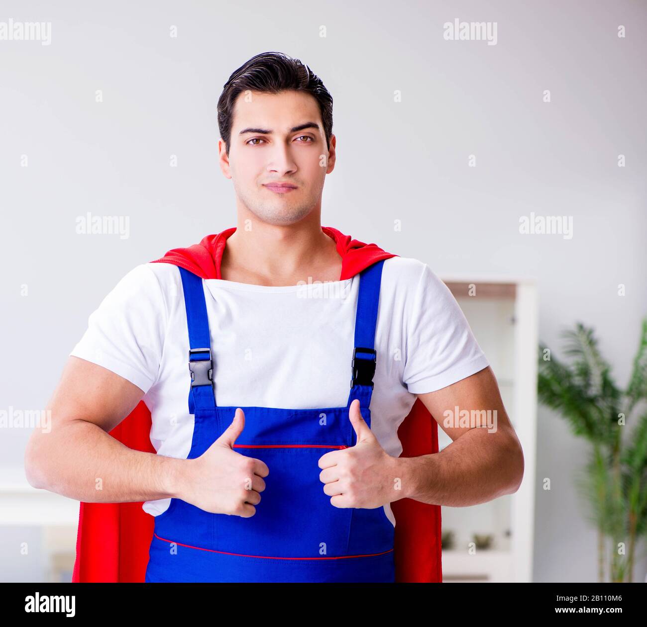 The superhero repairman with tools in repair concept Stock Photo - Alamy