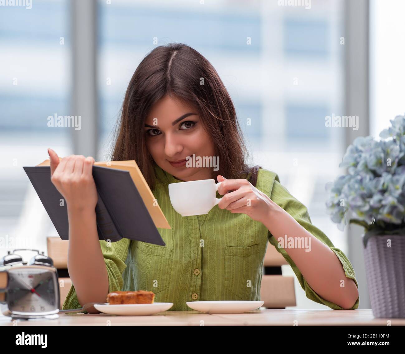 The young student preparing for exams drinking tea Stock Photo - Alamy