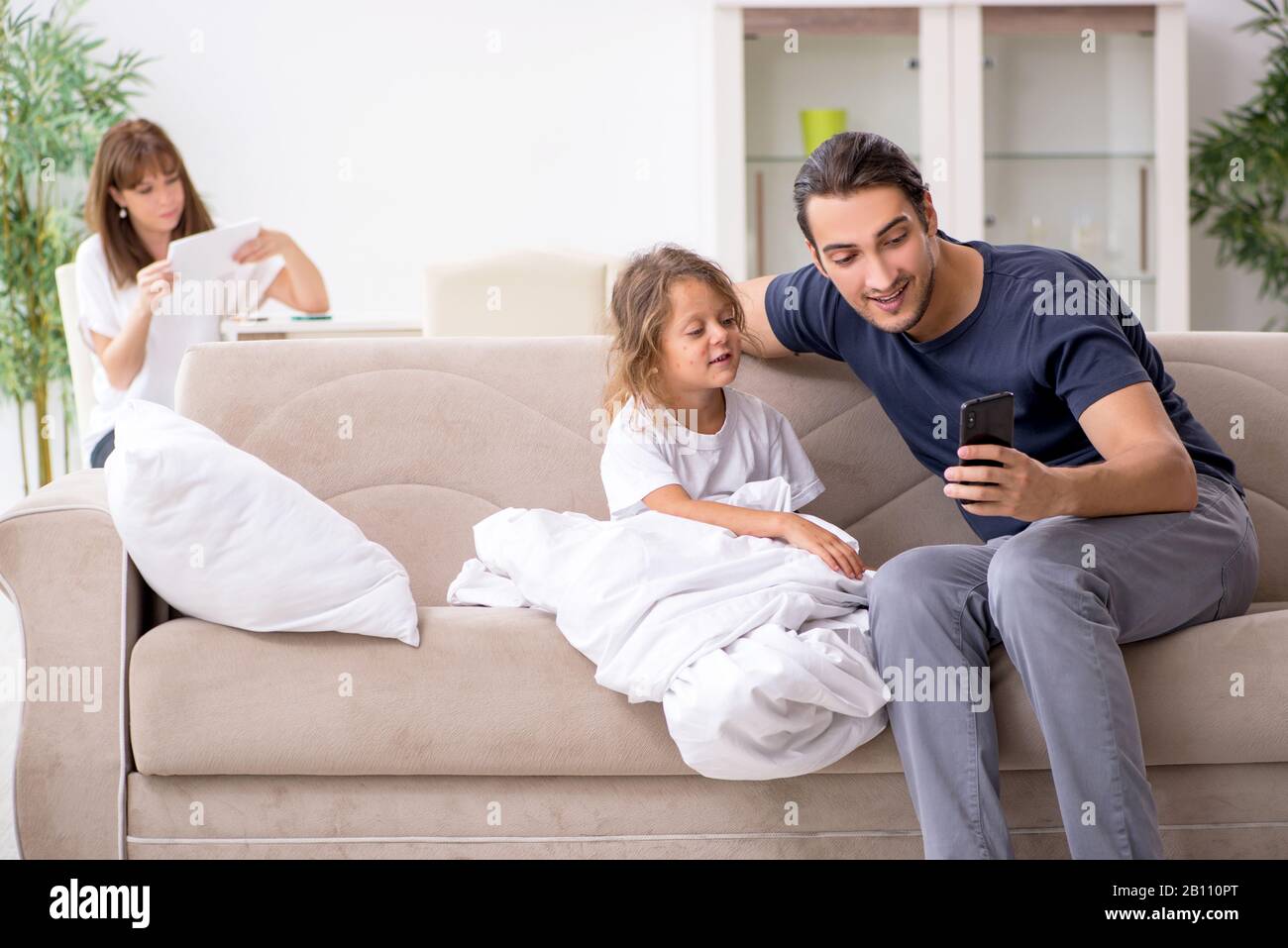 The father taking care of his ill daughter Stock Photo - Alamy