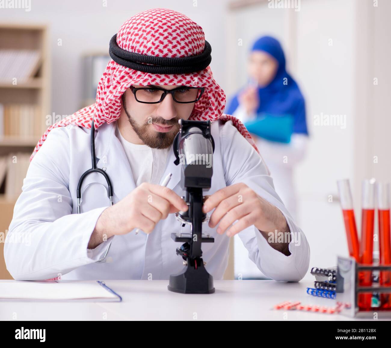 The arab doctor working in the lab hospital Stock Photo - Alamy