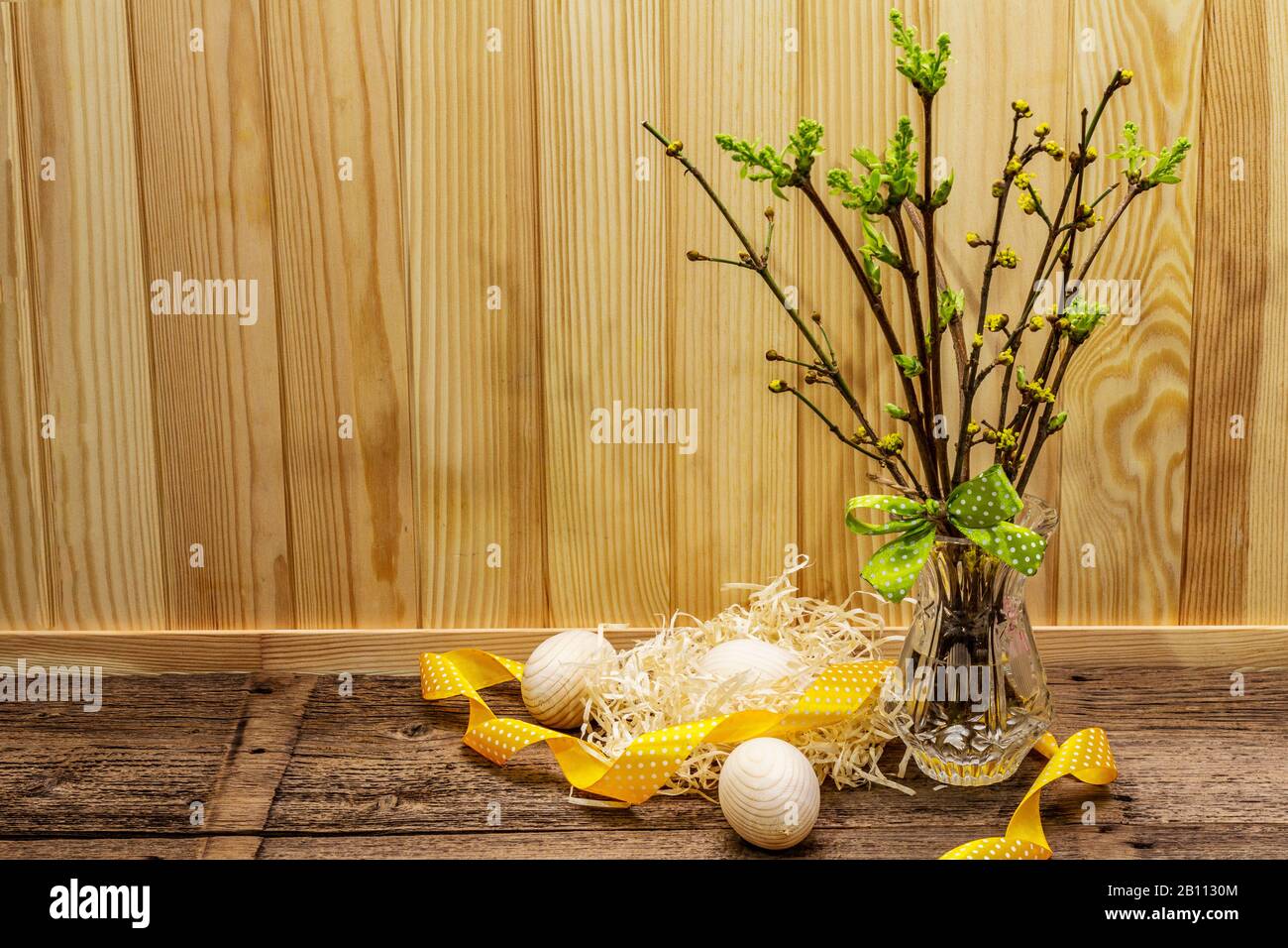 Zero waste Easter concept. Spring twigs with fresh green leaves. Glass ...