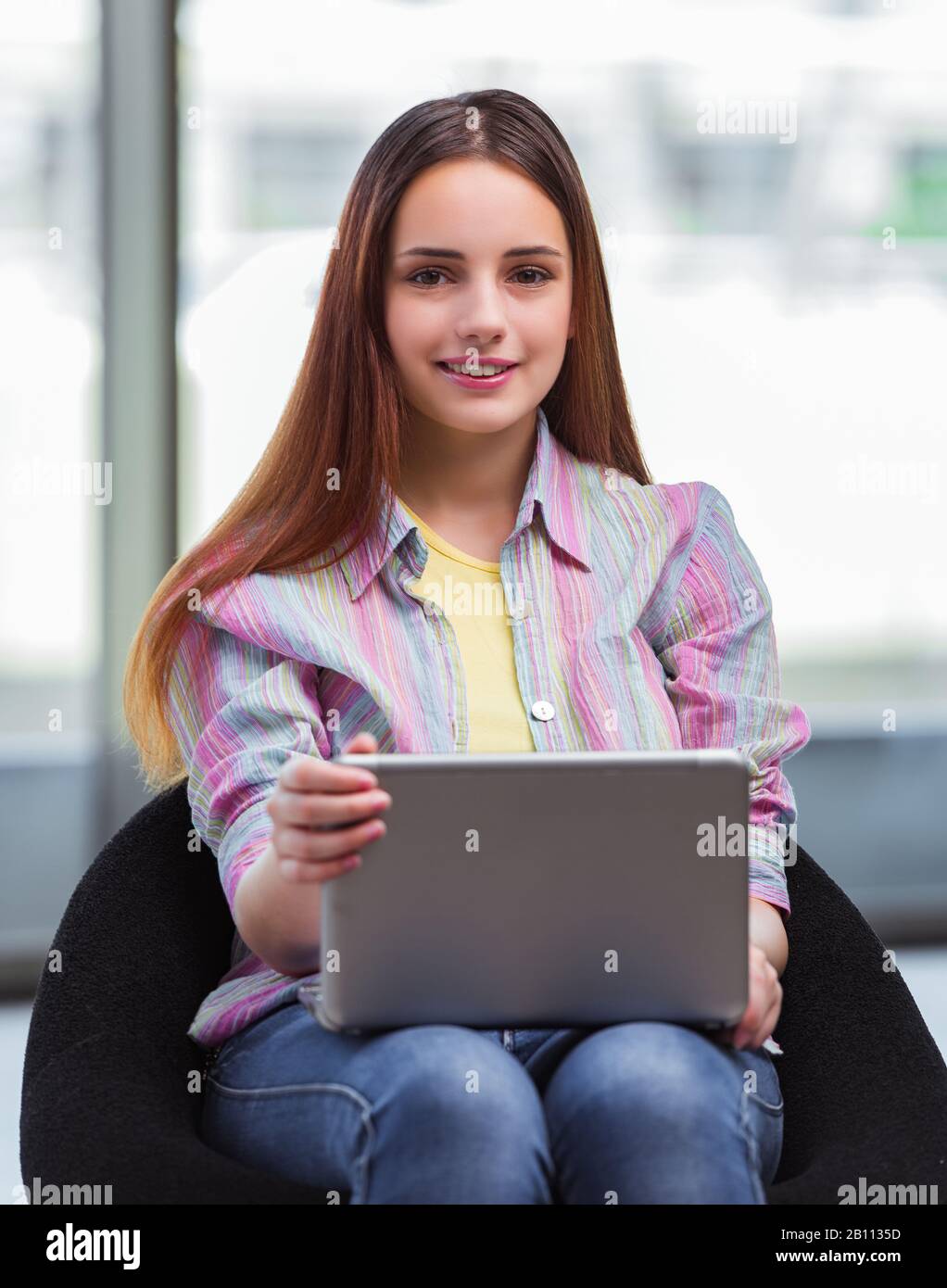 The young girl surfing internet on laptop Stock Photo - Alamy