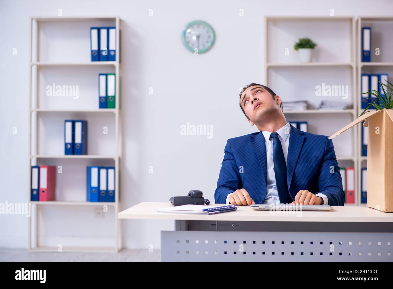 The young employee being made redundant Stock Photo - Alamy