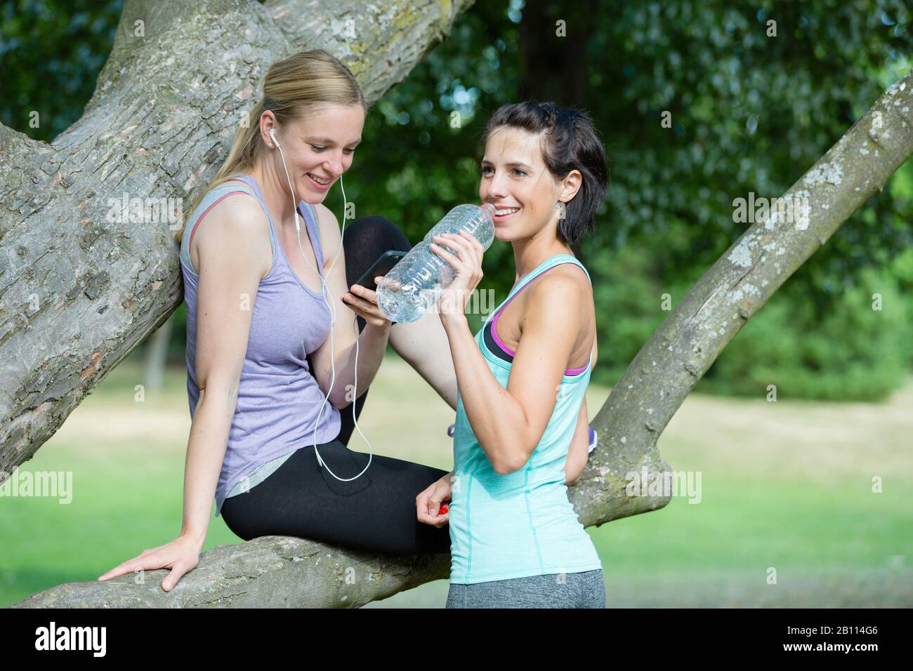 Two women in sportswear are talking Stock Photo - Alamy