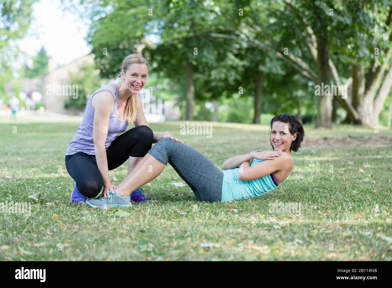 Two women doing strength training Stock Photo - Alamy