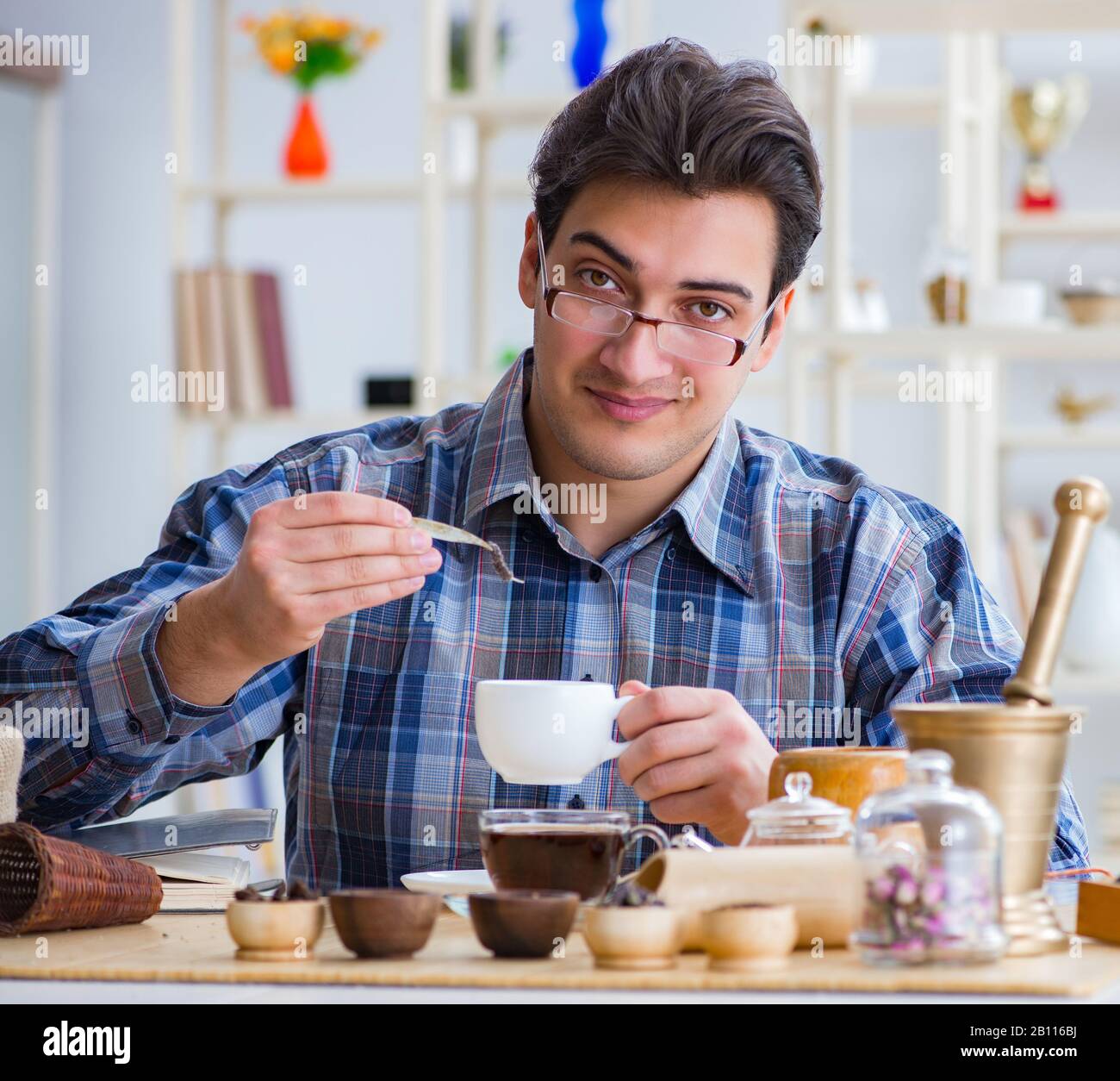 Tea expert brewing cup of drink hi-res stock photography and images - Alamy