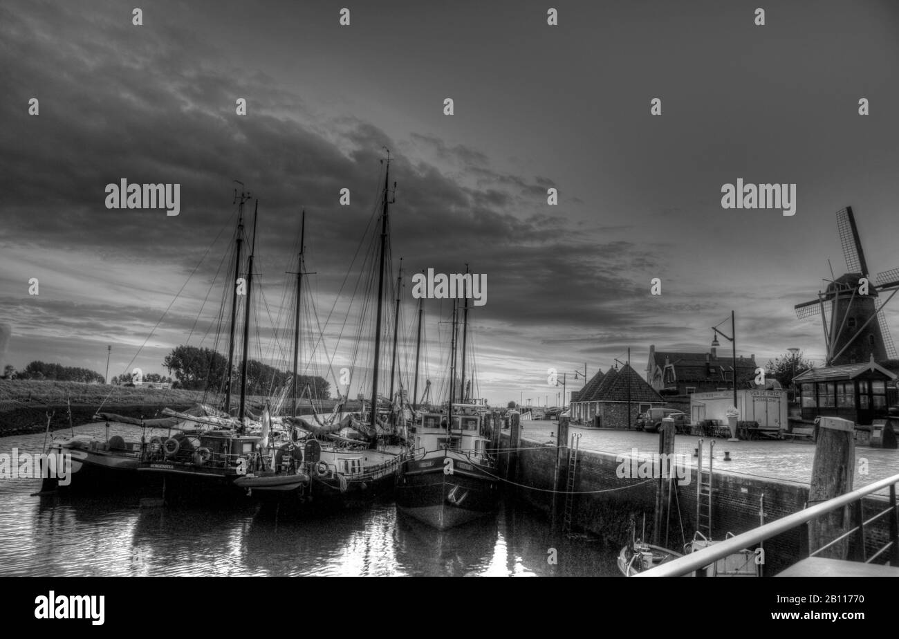 Sky and channel in sunset of Zeeland travel Stock Photo - Alamy
