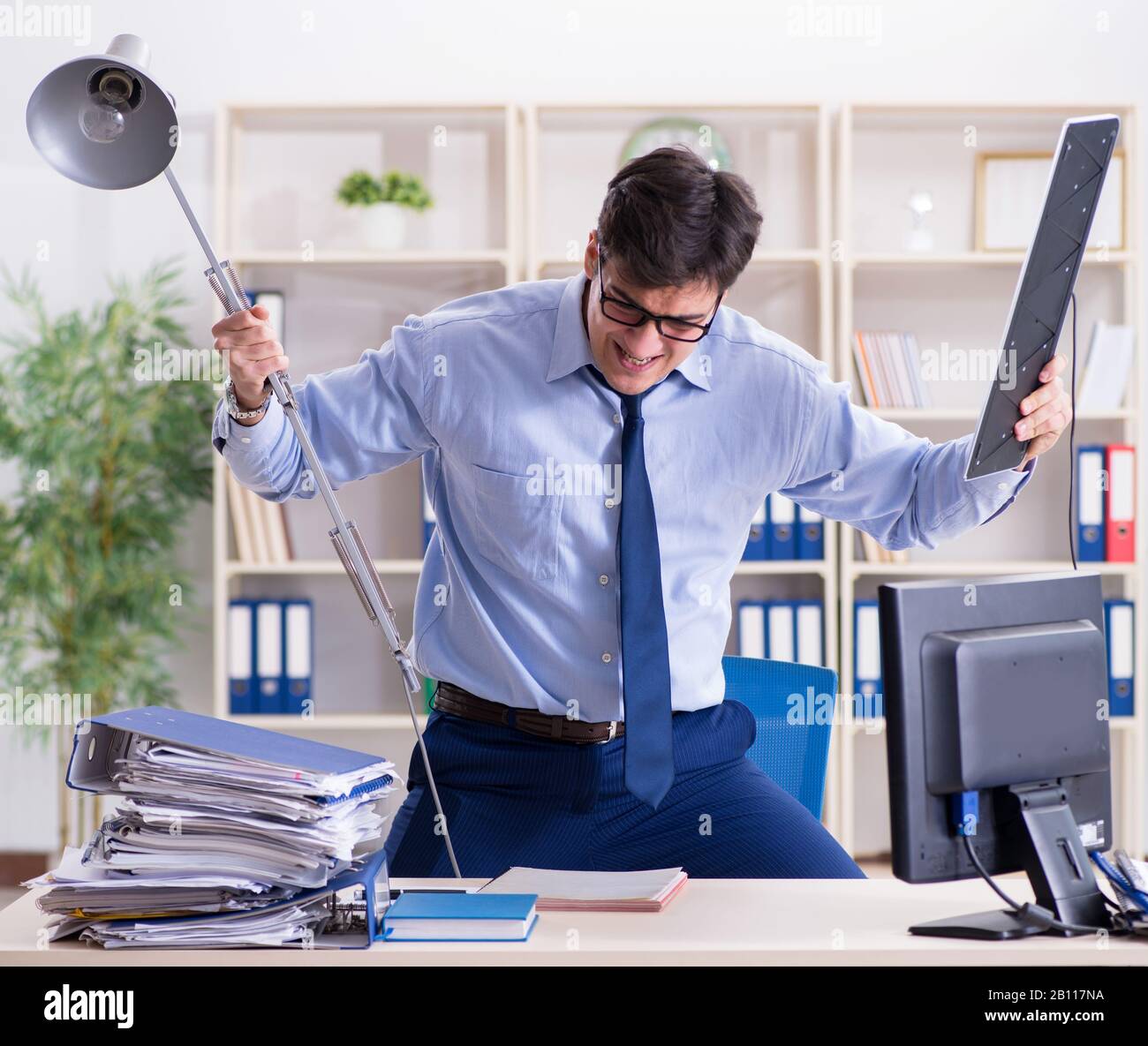 The angry businessman frustrated with too much work Stock Photo - Alamy
