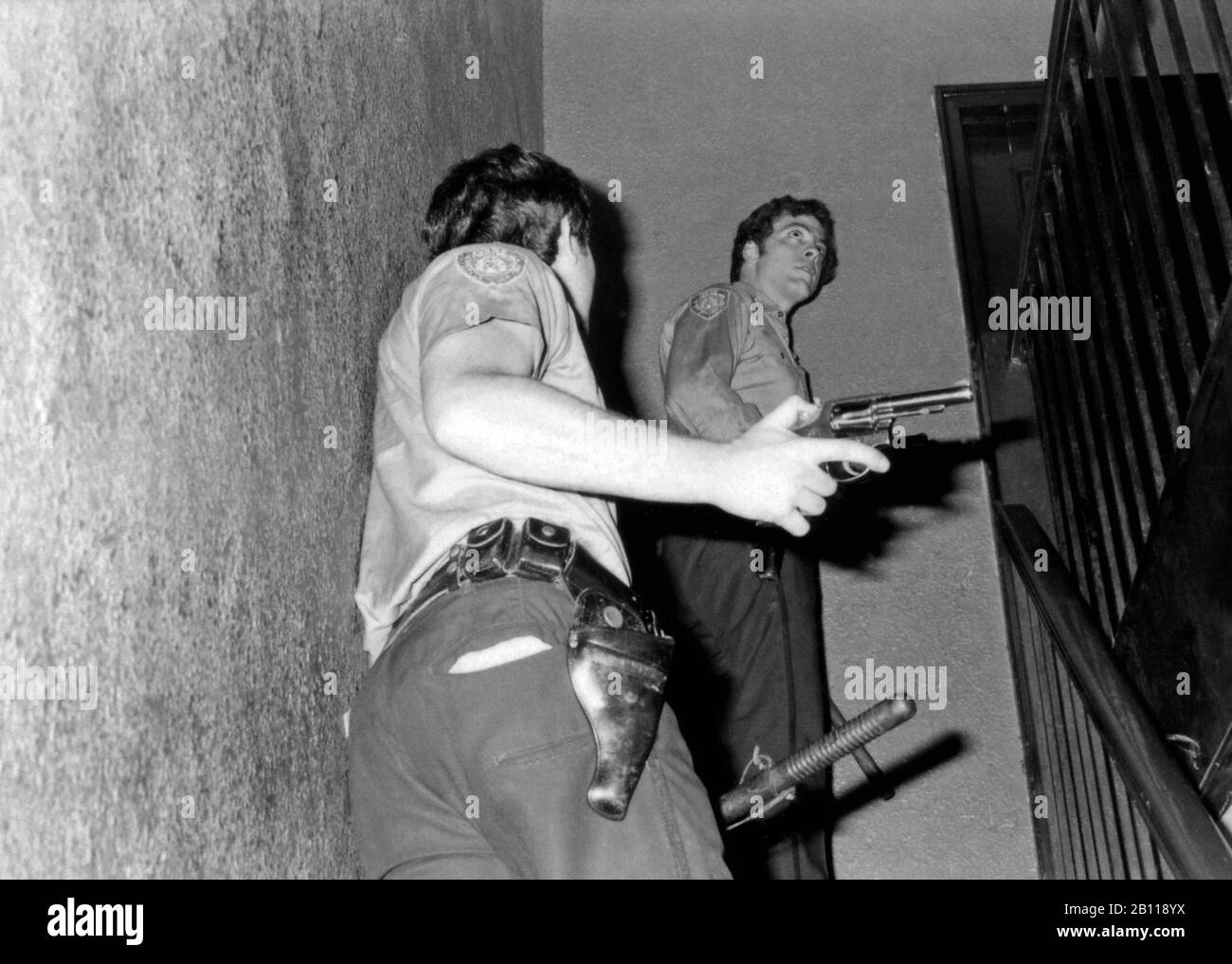 28th Precinct, New York policeman with guns drawn in Harlem, USA 70s ...