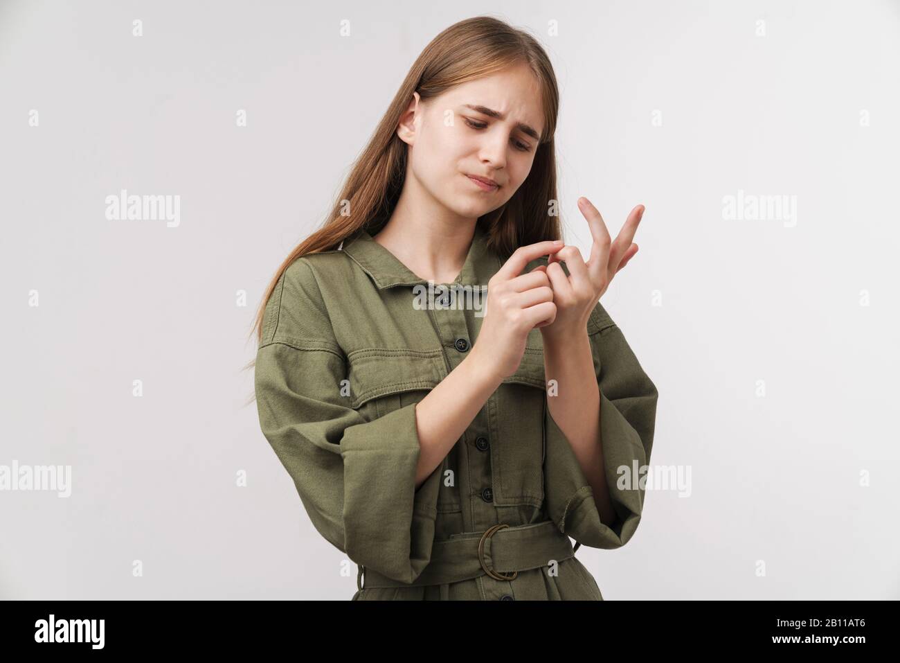 Photo of confused cute woman posing and counting her fingers isolated ...