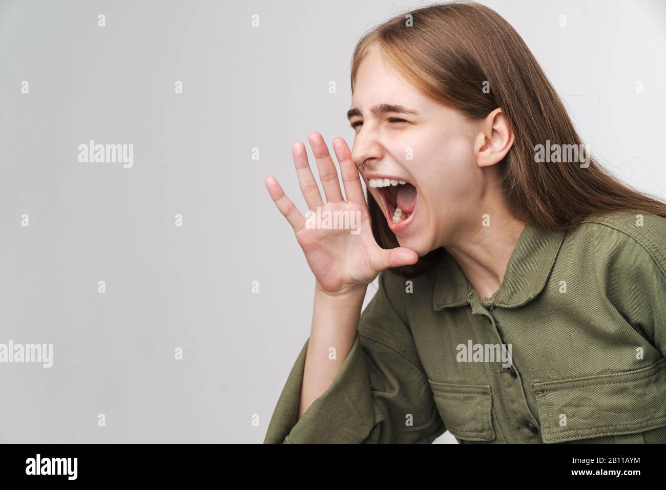 Photo of furious caucasian woman screaming with eyes closed isolated ...