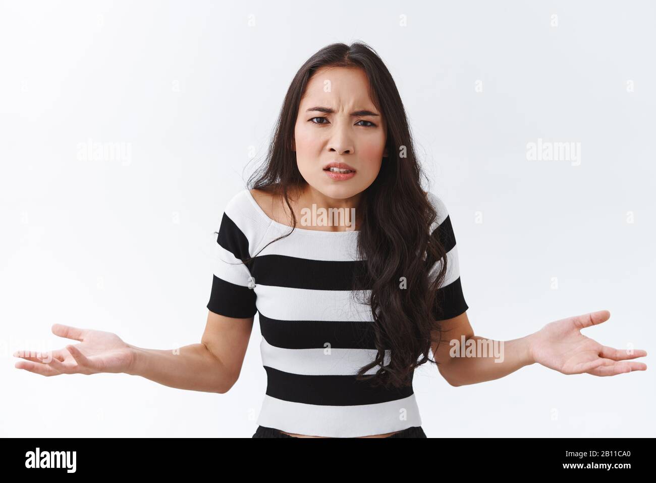 Whats your problem dude. Pissed and angry confused young woman ...