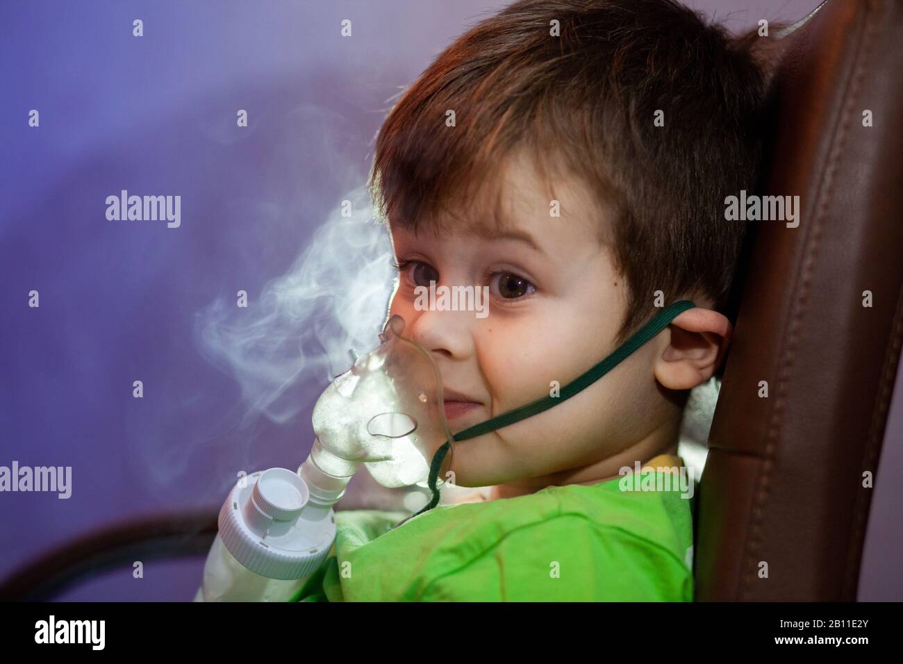 Little boy in a mask, treatments respiratory tract with a nebulizer at ...