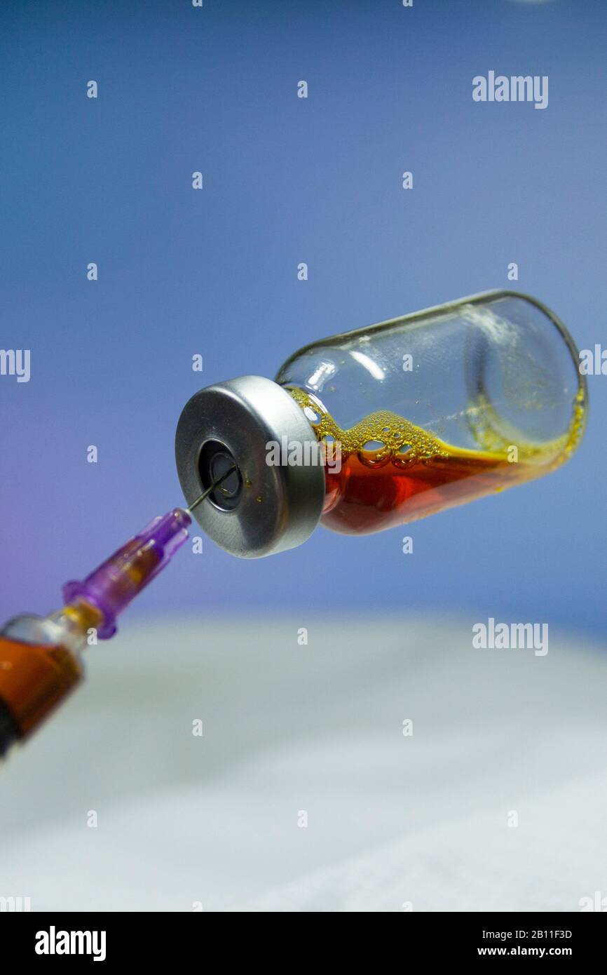 Close up vaccine vial needle dose flu vaccine drug syringe medical ...