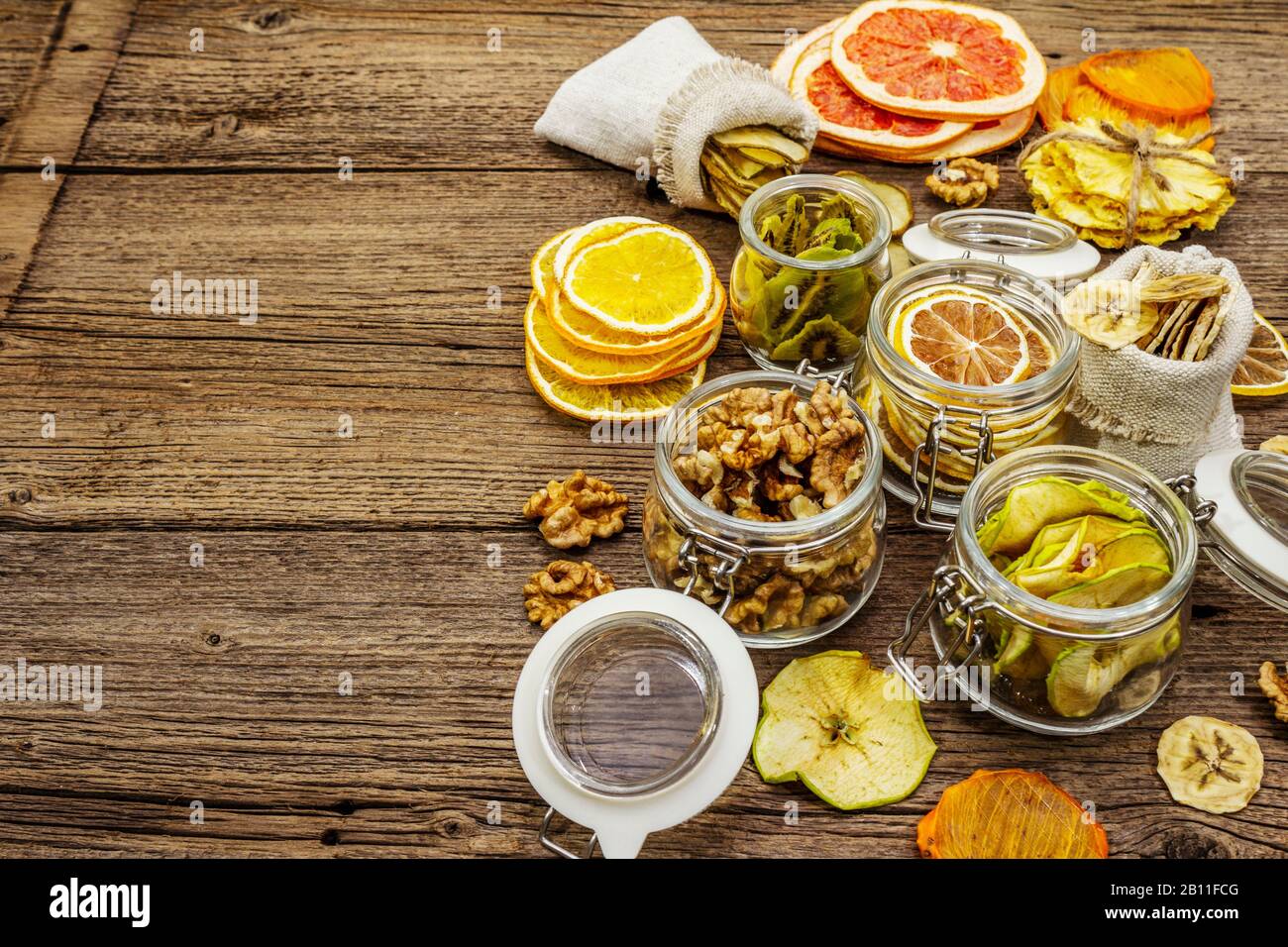 Zero waste food shopping concept. Assortment of dried fruits, walnuts ...