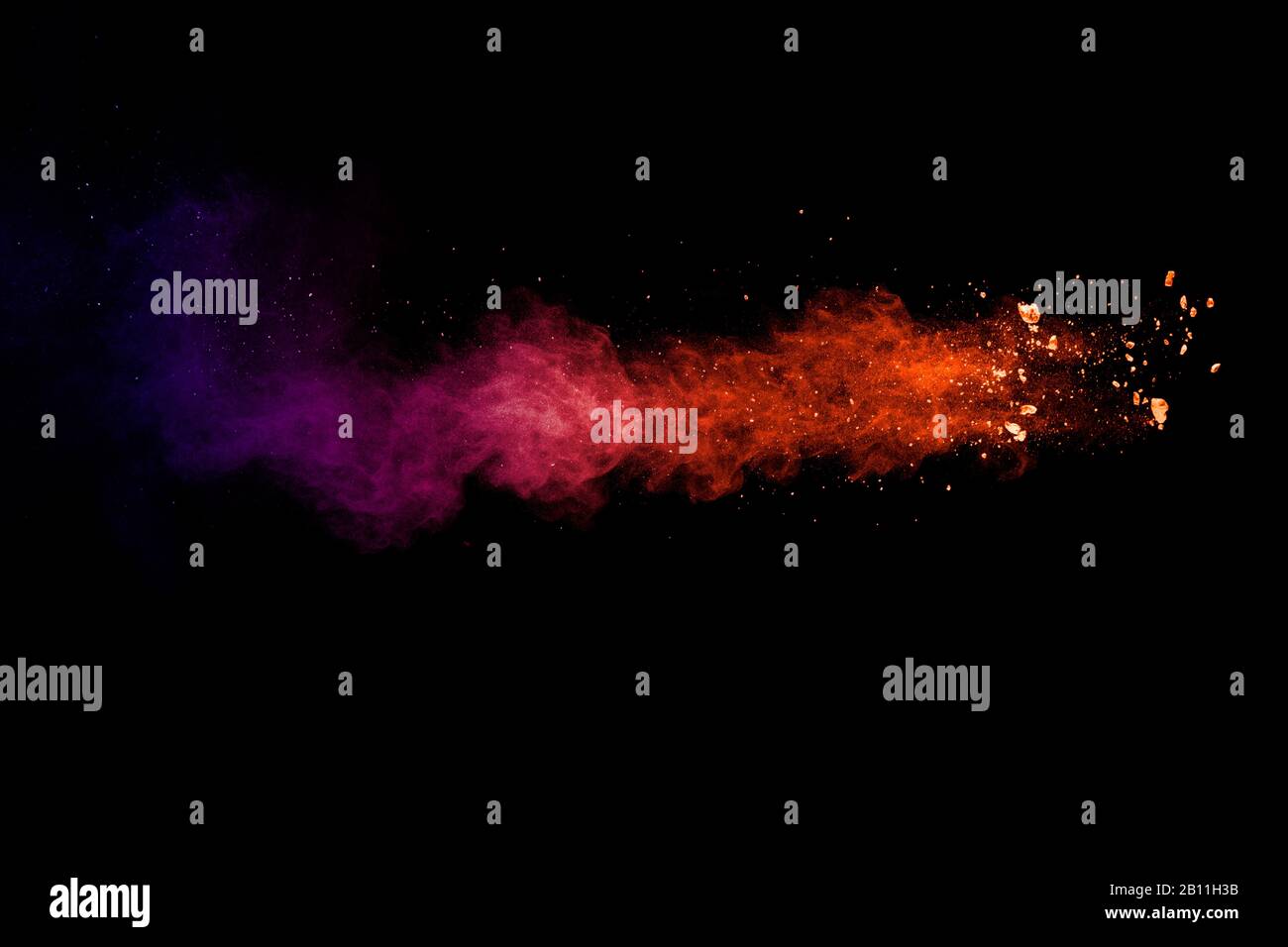 Orange blue powder explosion on black background.Orange blue color dust ...