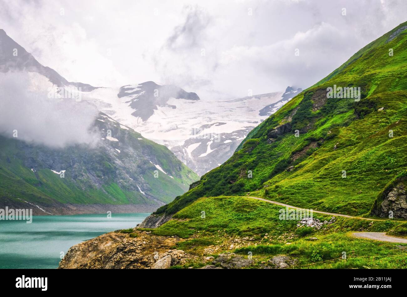 Green nature snowy mountains hi-res stock photography and images - Alamy