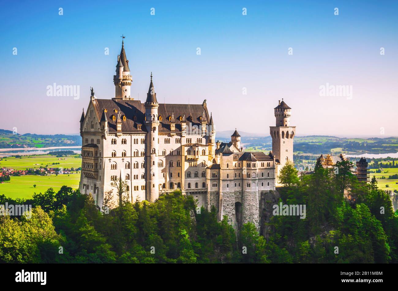 Famous medieval Neuschwanstein castle standing on high rocks in Germany ...
