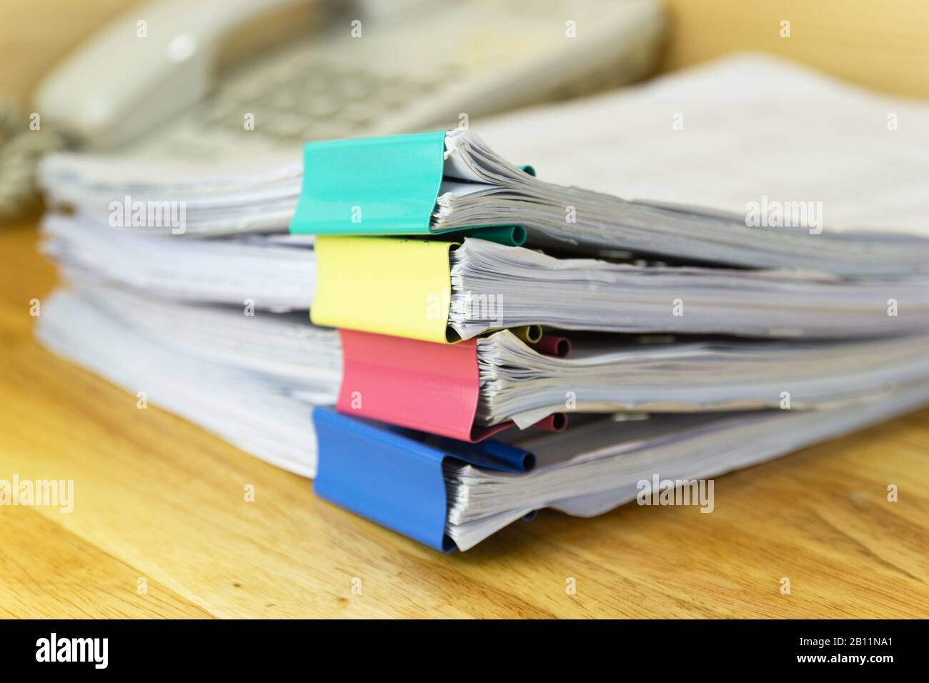file folder and Stack of business report paper file on the table in a ...