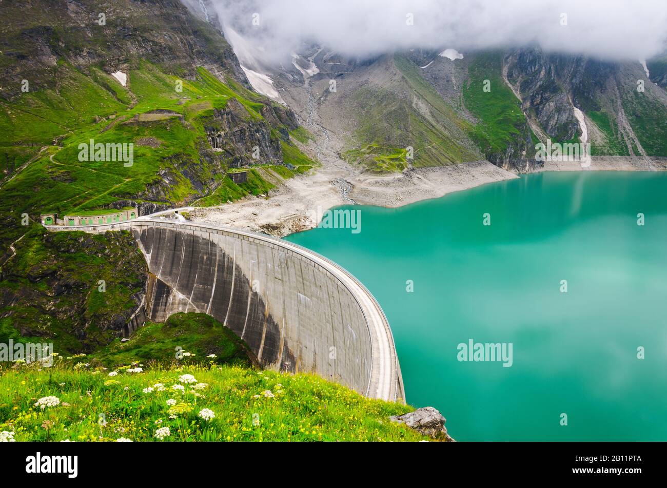 Hydroelectric power station along cloudy mountains. Kaprun dam Stock ...