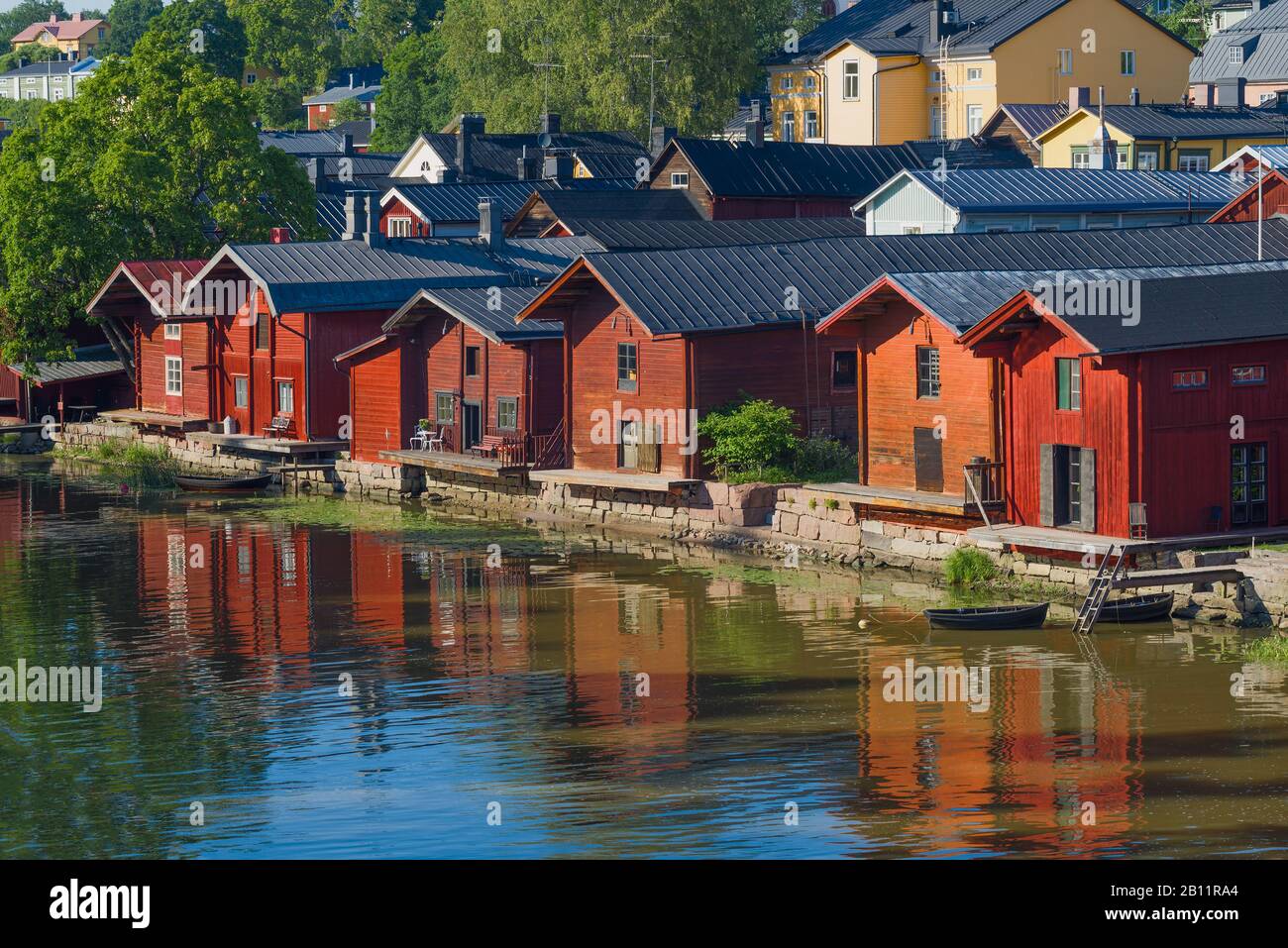 Old red barns on the Porvoonyoki River on a sunny July day. Old Porvoo ...