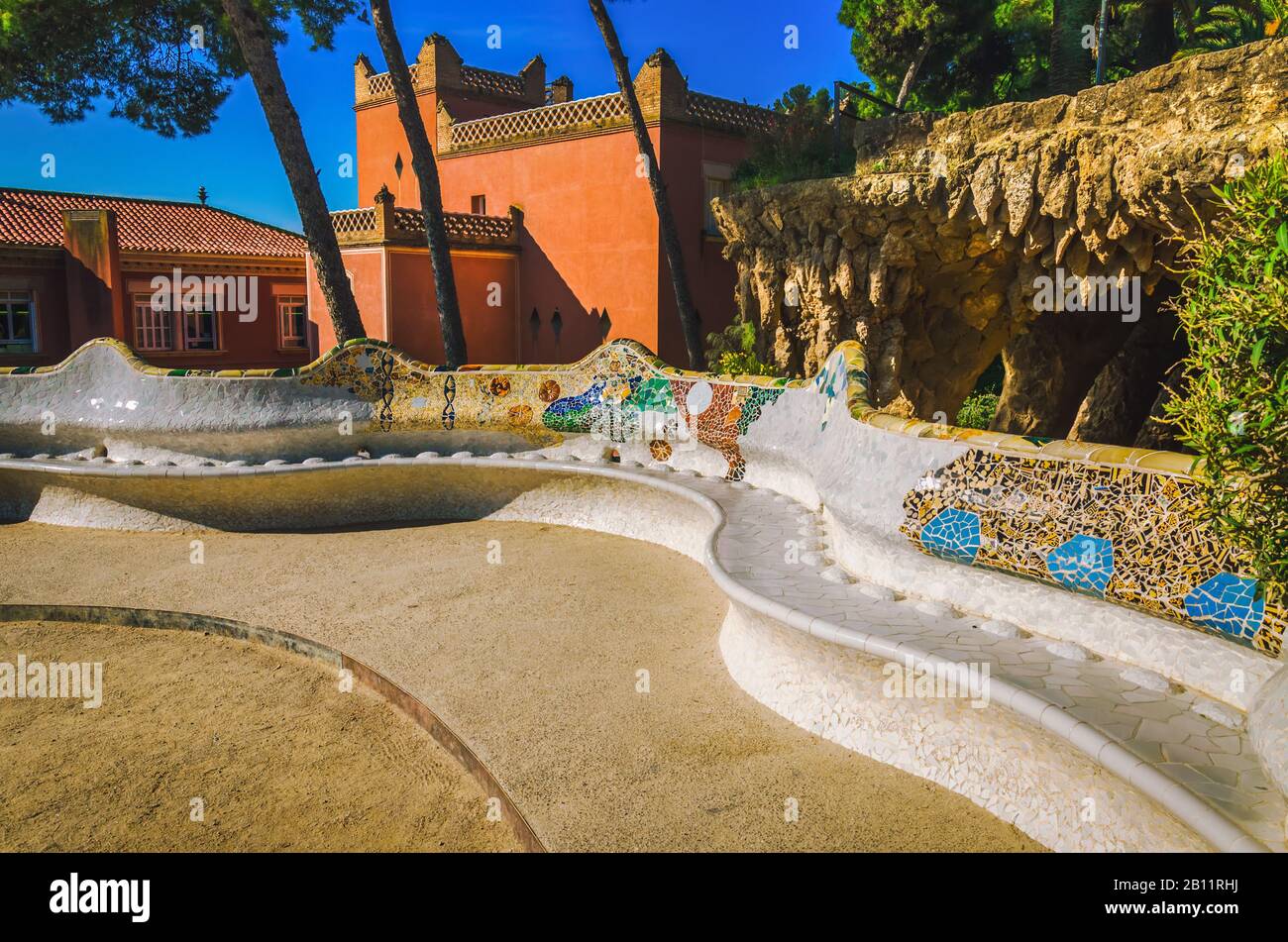 The famous unique shape mosaic bench at Park Guell in Barcelona city ...