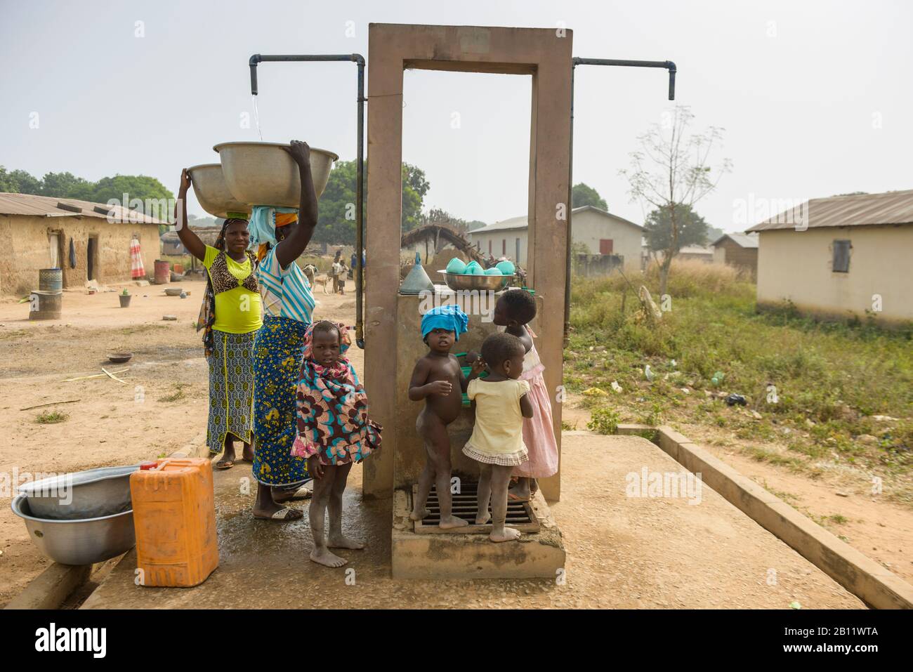 Collecting water in North Benin, Africa Stock Photo - Alamy