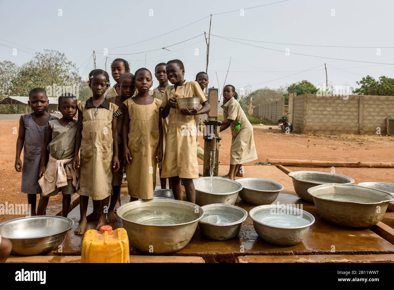 Collecting water in North Benin, Africa Stock Photo - Alamy